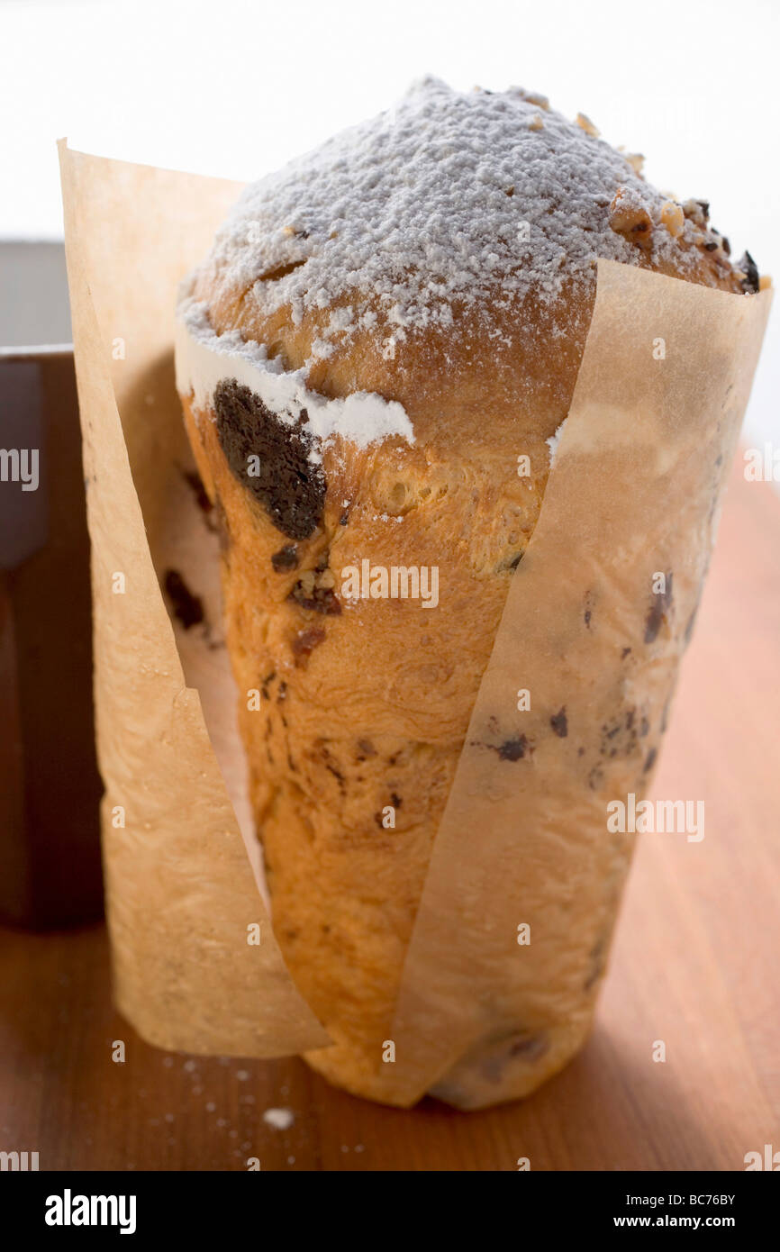 Small cranberry panettone in baking parchment Stock Photo - Alamy