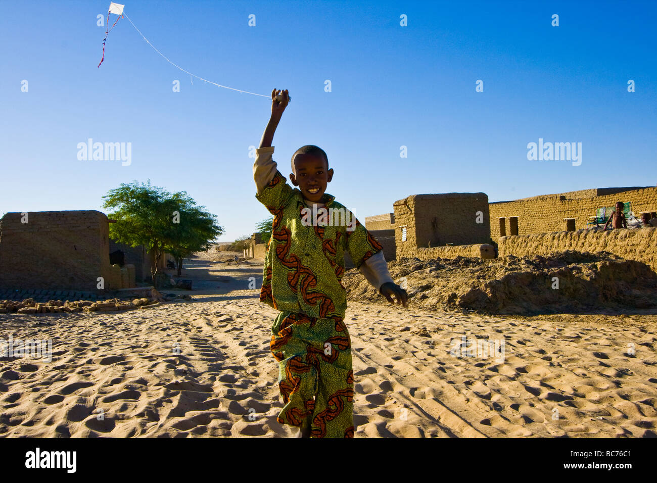 Malian Boy Pulling a Kite in Timbuktu Mali Stock Photo - Alamy