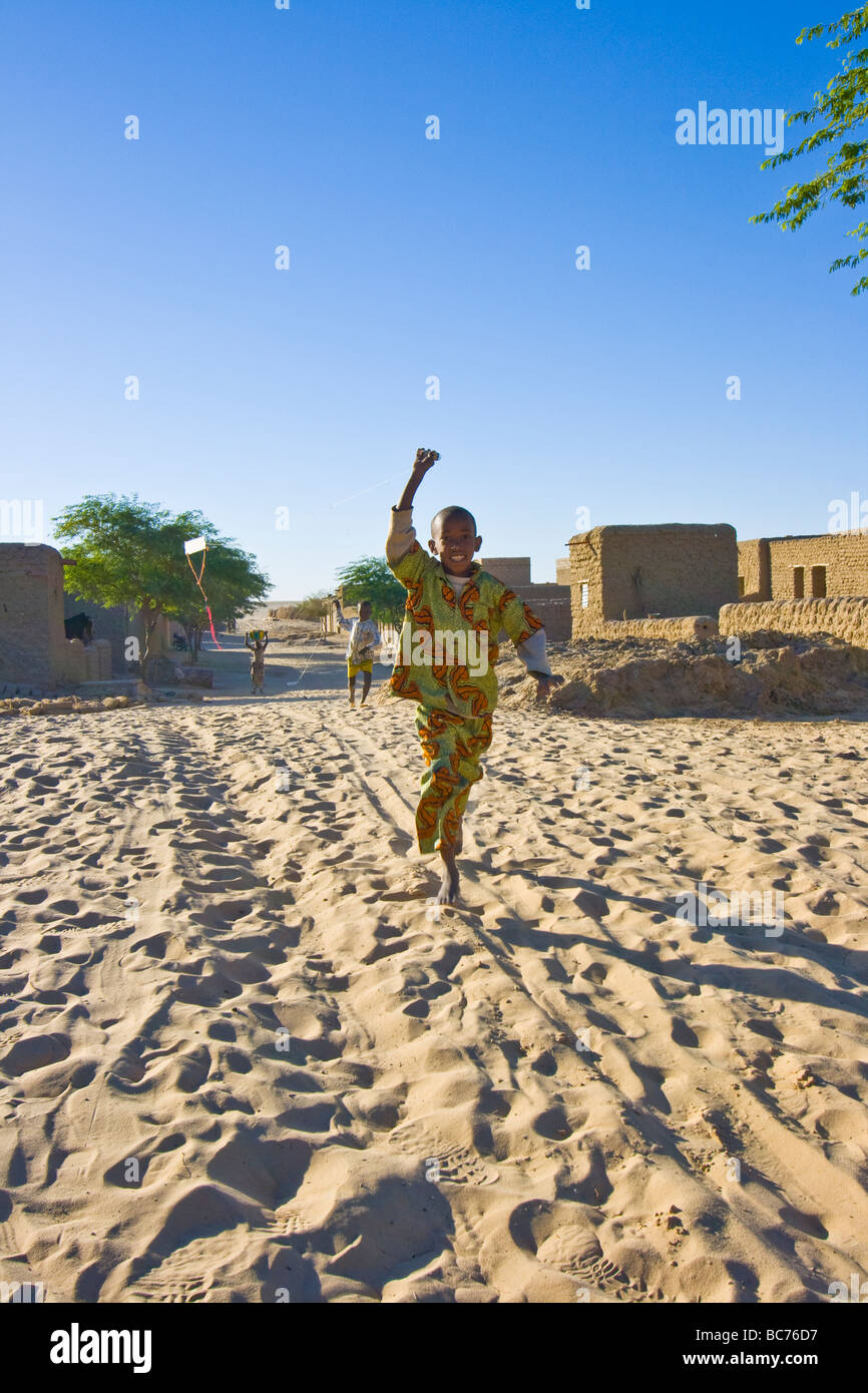 Malian Boy Pulling a Kite in Timbuktu Mali Stock Photo - Alamy