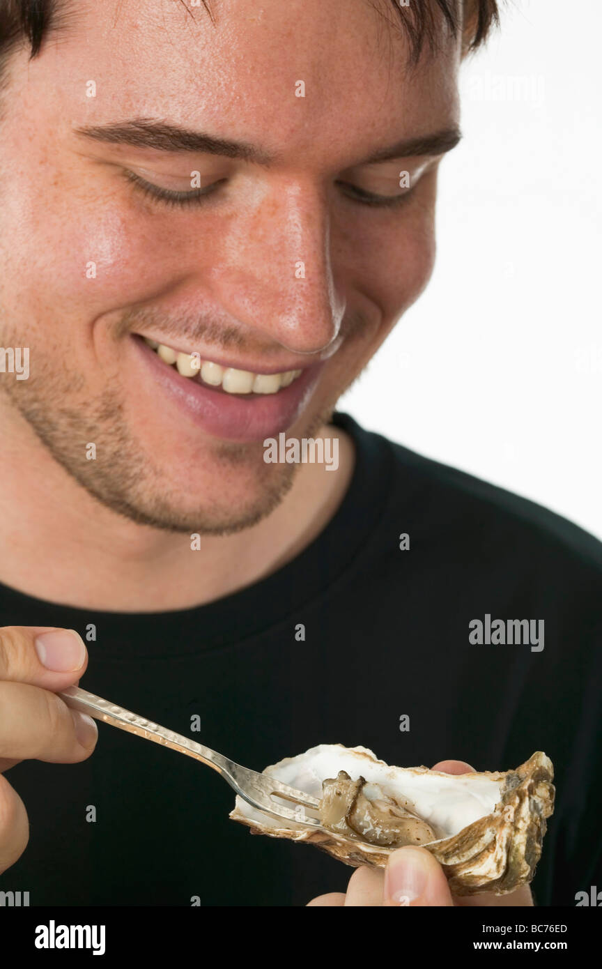 Man eating a fresh oyster Stock Photo - Alamy