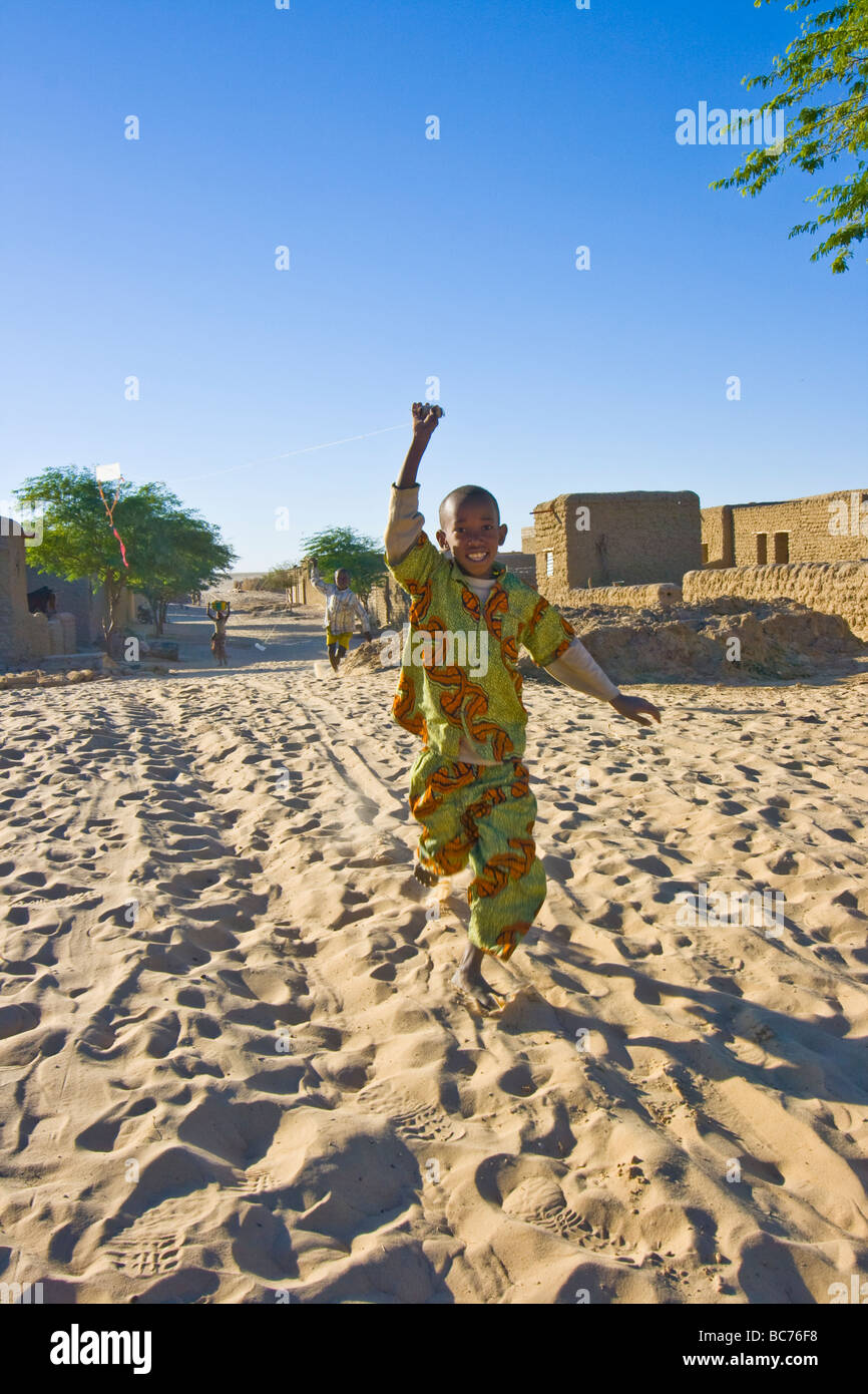 Malian Boy Pulling a Kite in Timbuktu Mali Stock Photo - Alamy