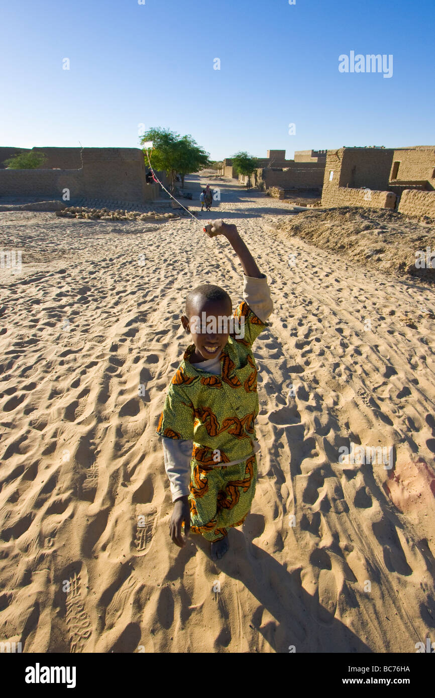 Malian Boy Pulling a Kite in Timbuktu Mali Stock Photo - Alamy