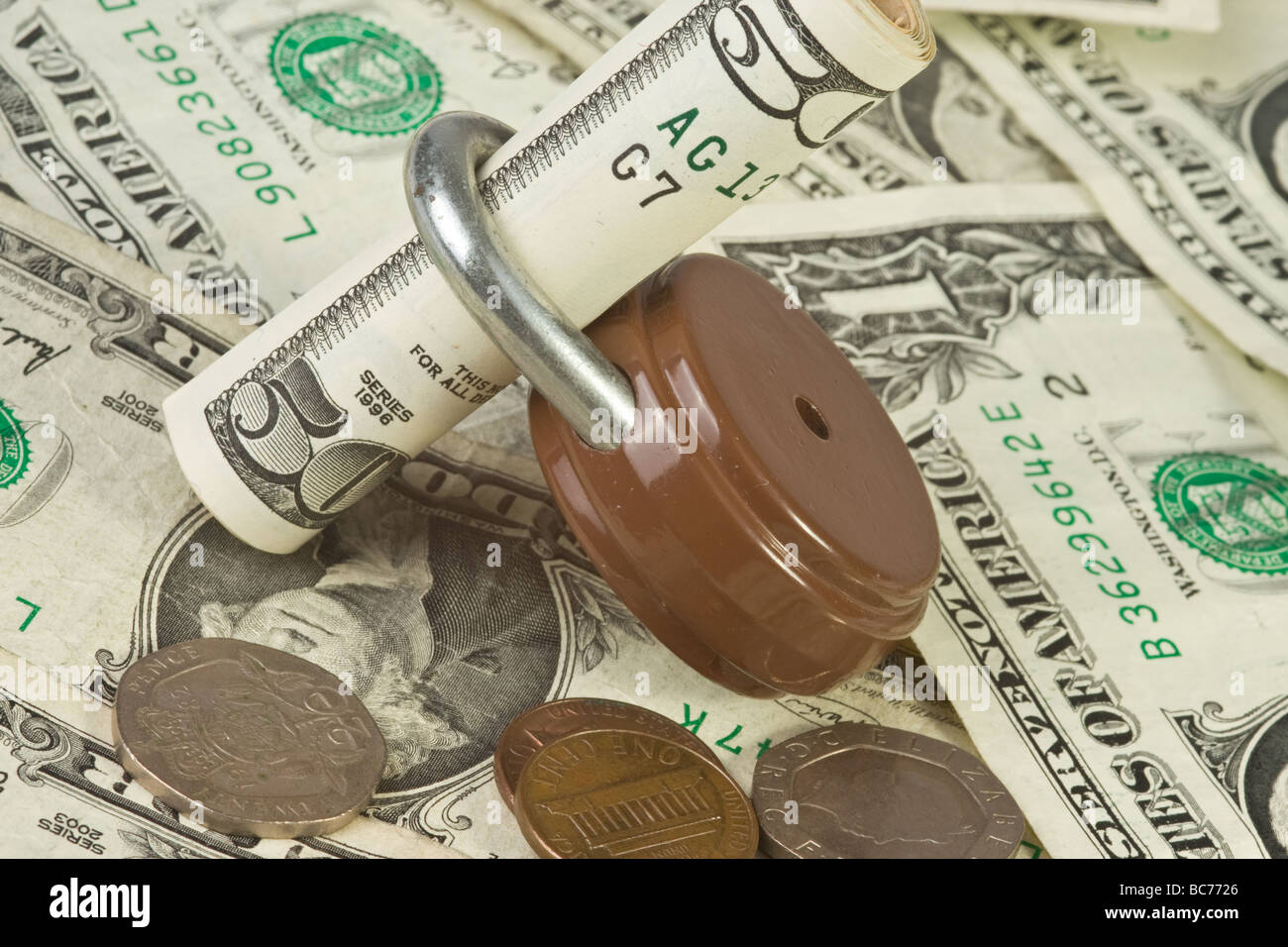 locked dollars on white background Stock Photo - Alamy