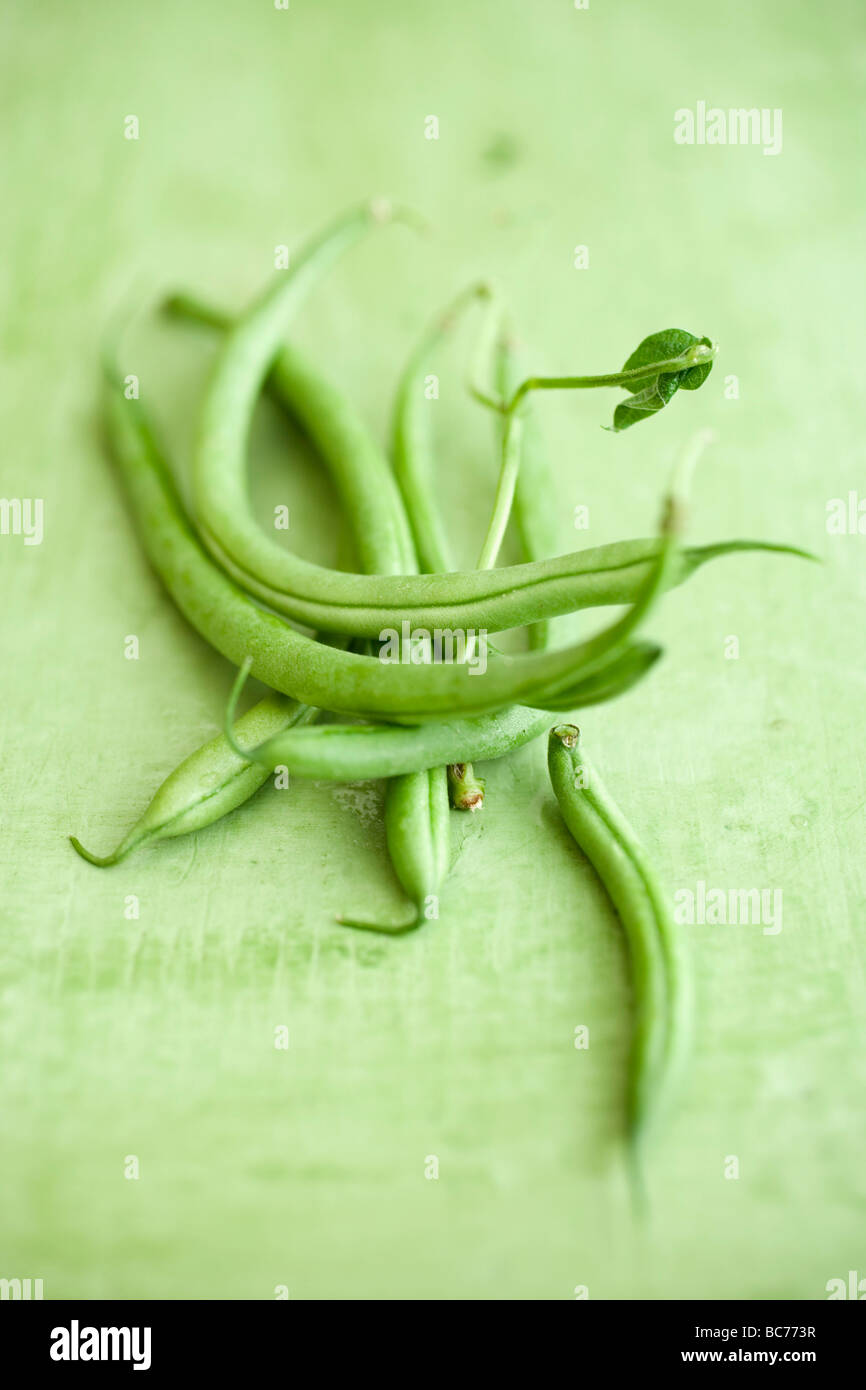 French beans on green background Stock Photo - Alamy