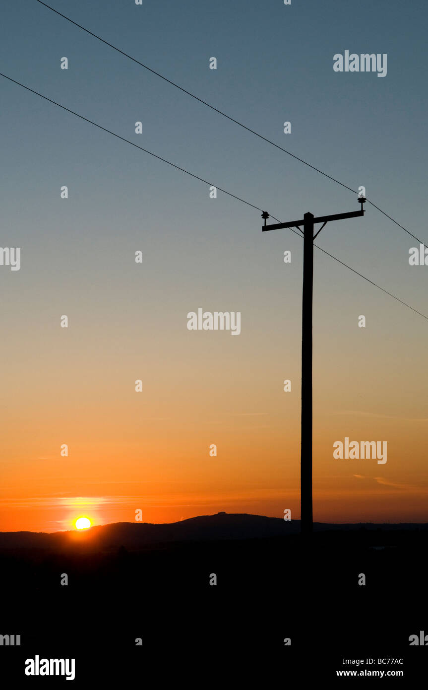 Sunset and electricity cables Stock Photo - Alamy