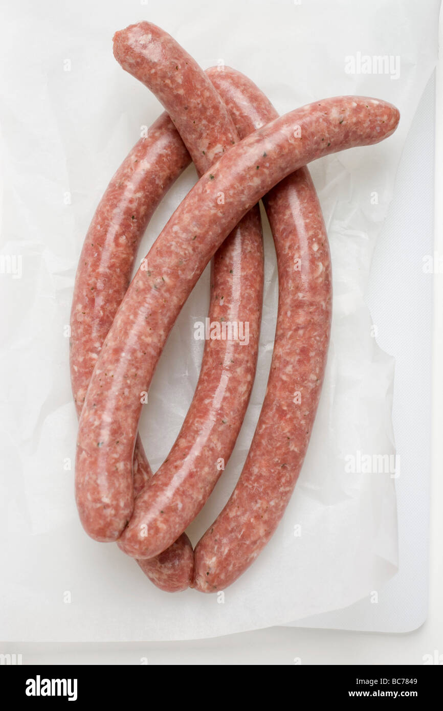 Four sausages on paper Stock Photo - Alamy