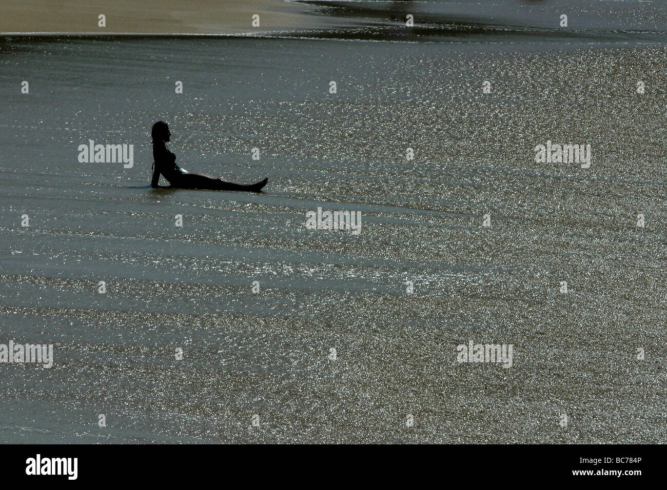 Woman on sandy beach, Hawaii Stock Photo - Alamy