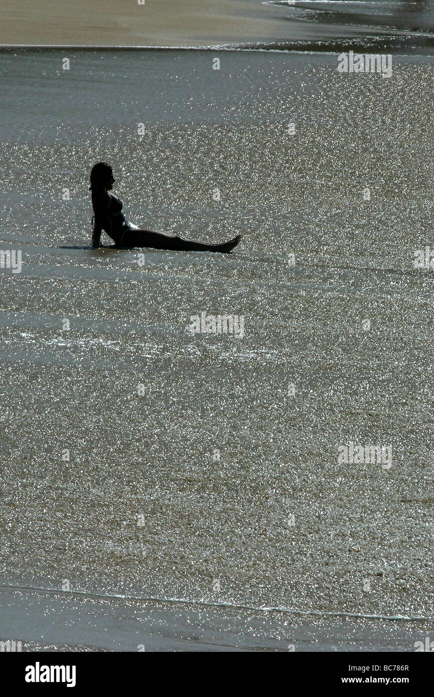 Woman on sandy beach, Hawaii Stock Photo - Alamy