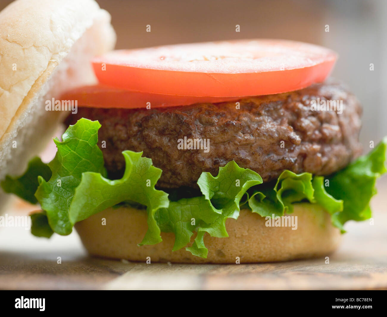 Hamburger with tomato slices Stock Photo - Alamy