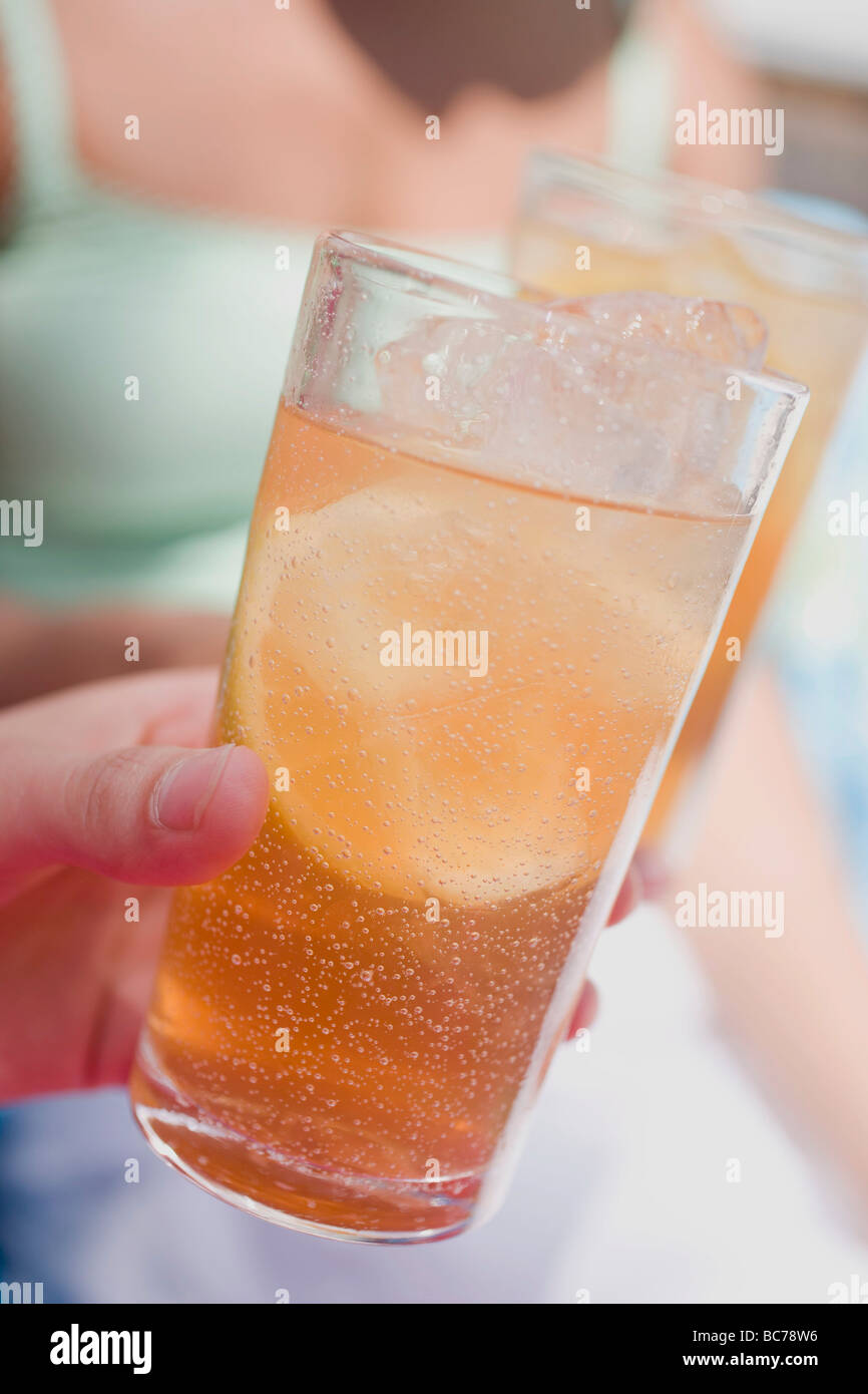 Hands holding iced tea hi-res stock photography and images - Alamy