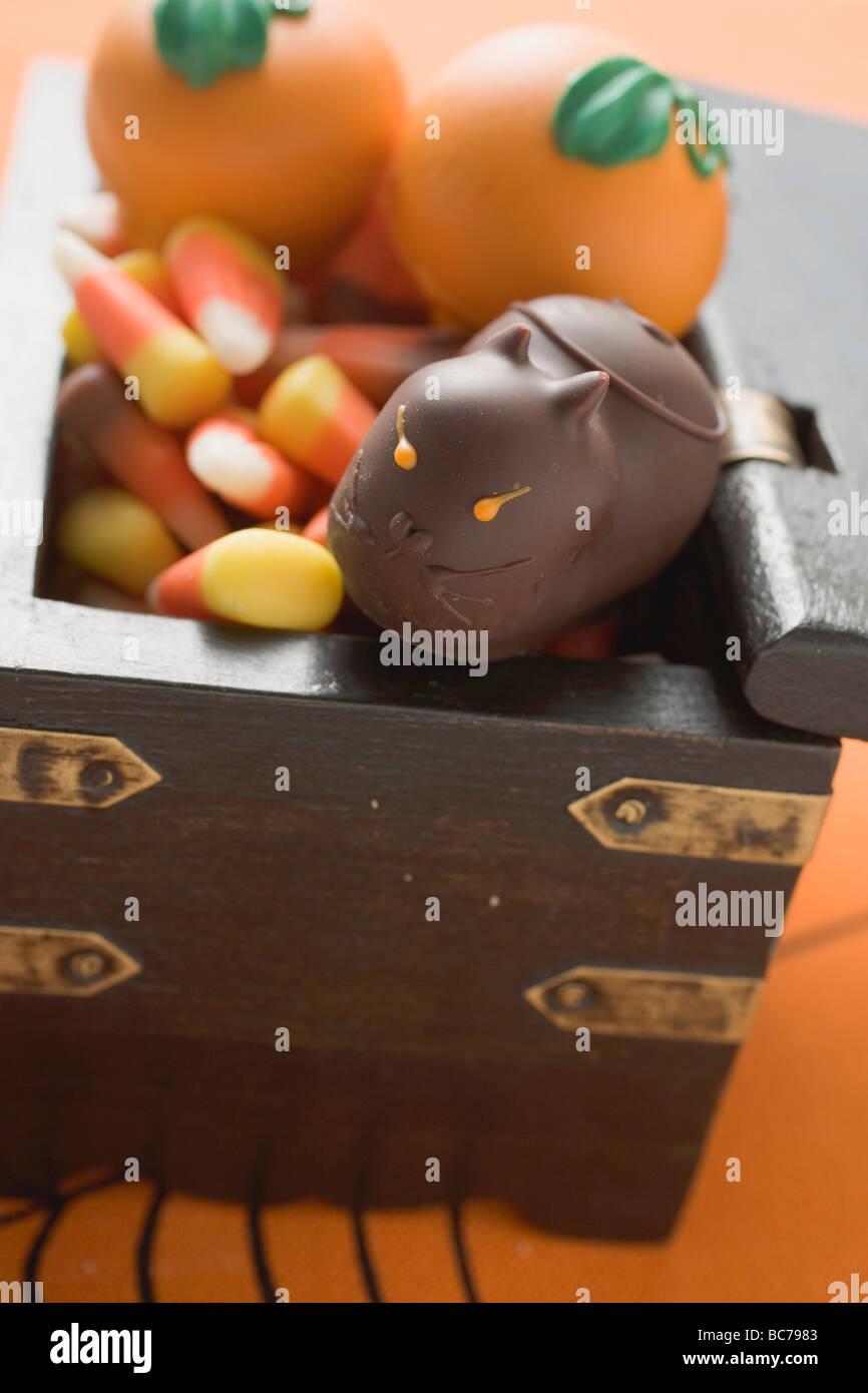 Assorted sweets for Halloween in treasure chest Stock Photo - Alamy