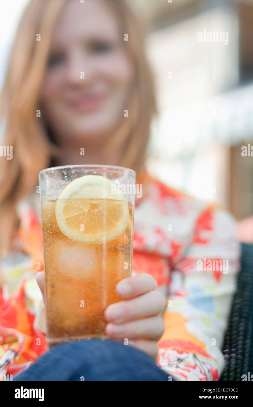 Woman holding glass iced tea hi-res stock photography and images - Alamy