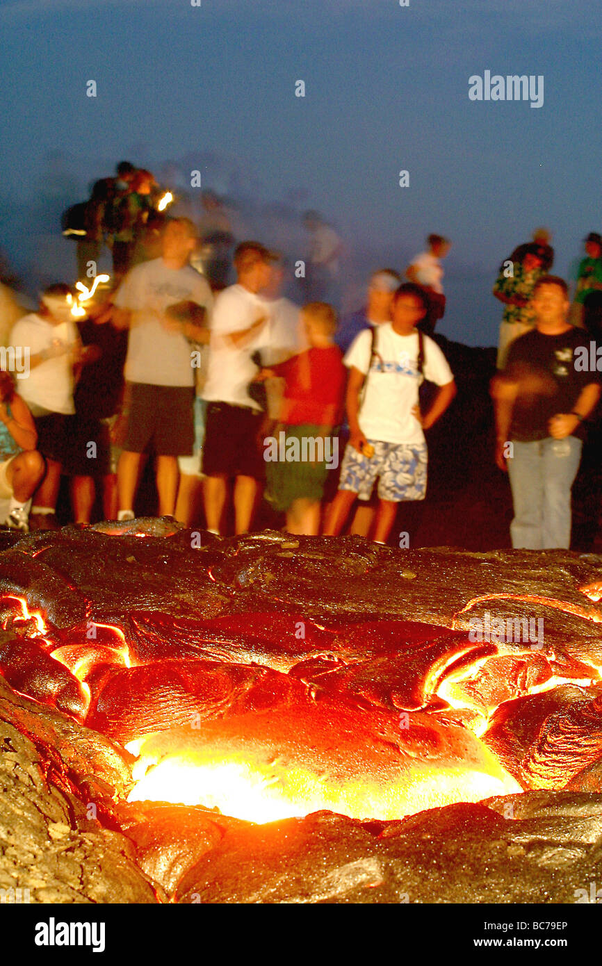 Tourists watching flowing lava from an active volcano Stock Photo - Alamy