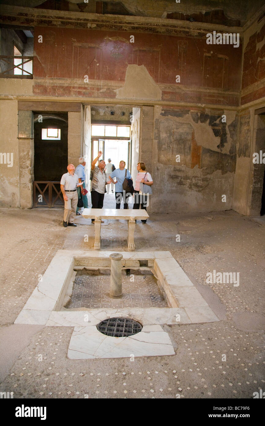Roman house interior showing fountain and mosaic floor Herculaneum ...