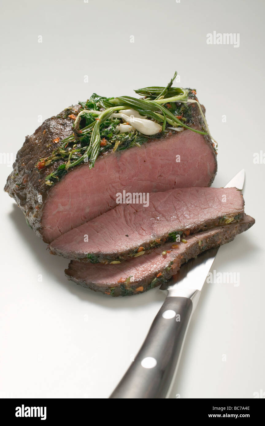Roast beef, partly carved Stock Photo - Alamy