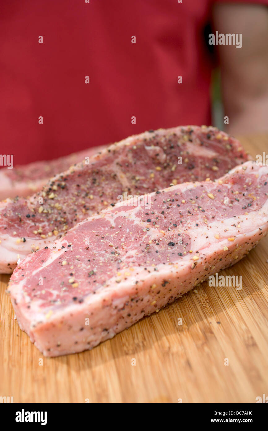 Raw meat being seasoned hi-res stock photography and images - Alamy