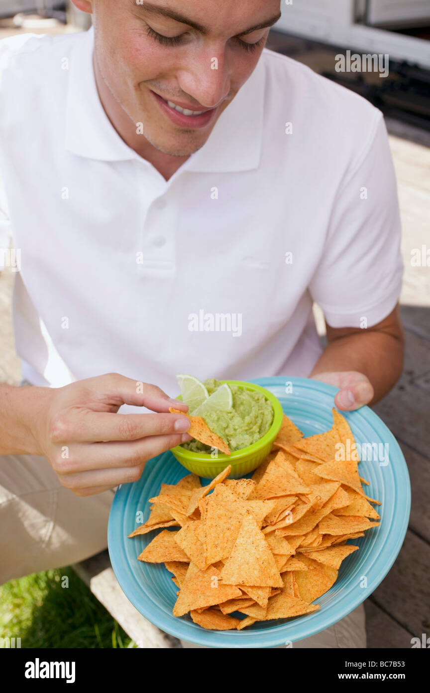 Man eating taco and guacamole hi-res stock photography and images - Alamy