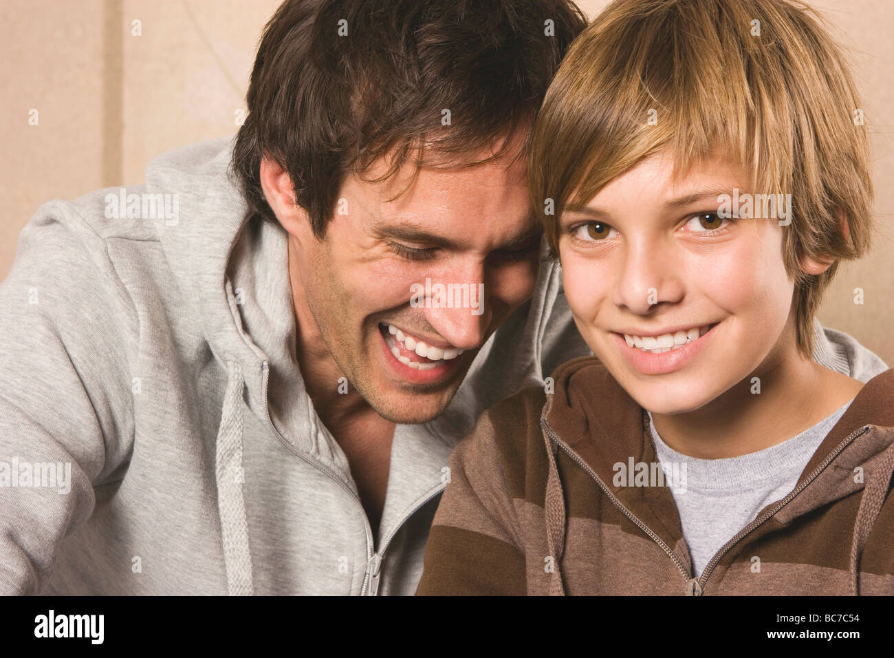 Father and son (13-14), smiling, portrait Stock Photo - Alamy
