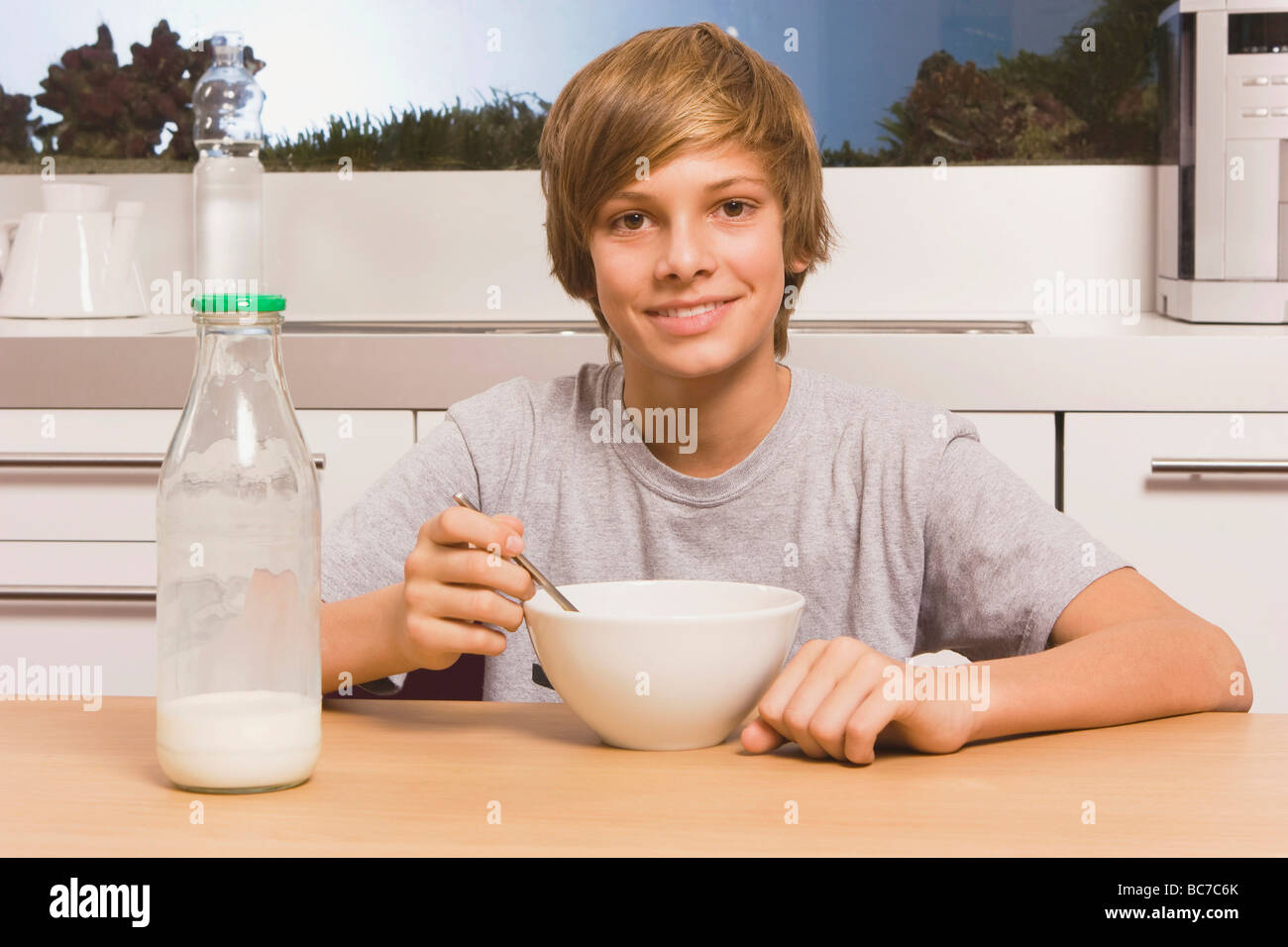 Teenage boy (13-14) having breakfast, portrait Stock Photo - Alamy
