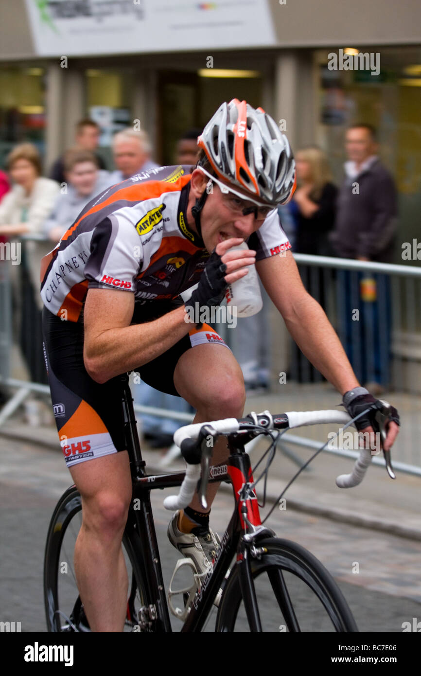 Racing Thirst a pro cycle rider taking a drink during a street race ...