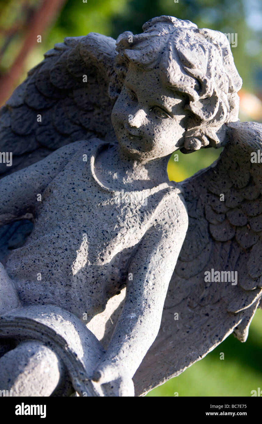 Close up of the gray angel statue with wings Stock Photo - Alamy