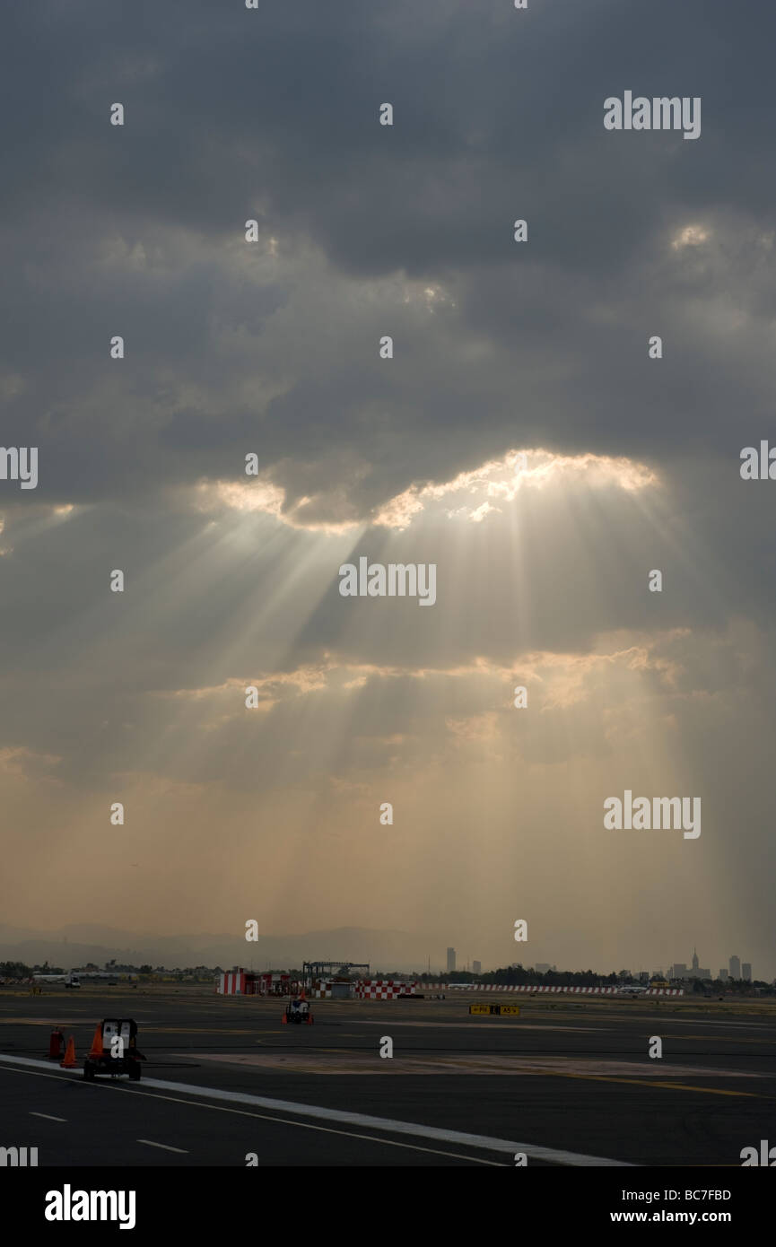 Light leaking from the clouds in Mexico City Airport Stock Photo - Alamy