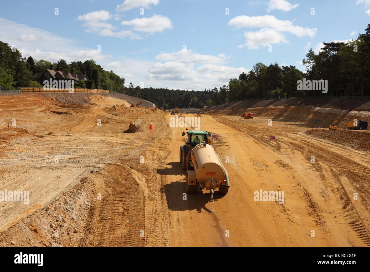 Spraying water to lay dust on the A3 Hindhead Tunnel roadworks, Surrey ...