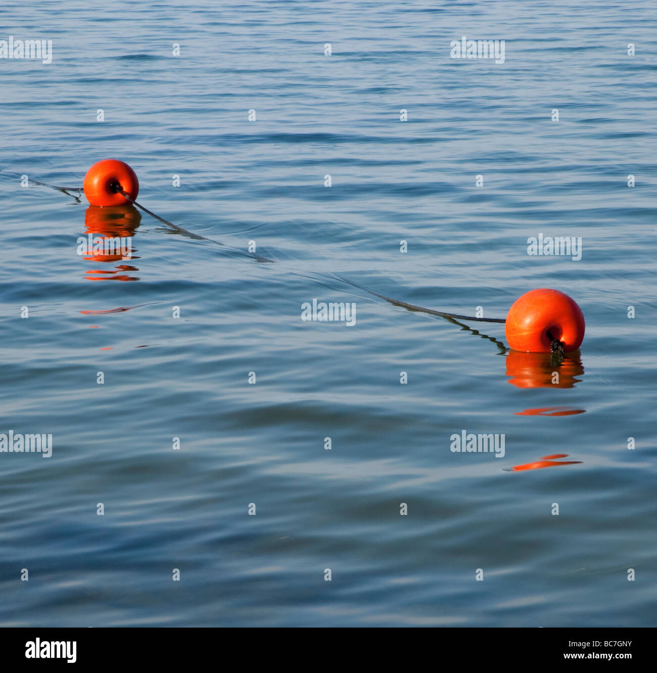 Two red buoys at the sea Spain Stock Photo - Alamy