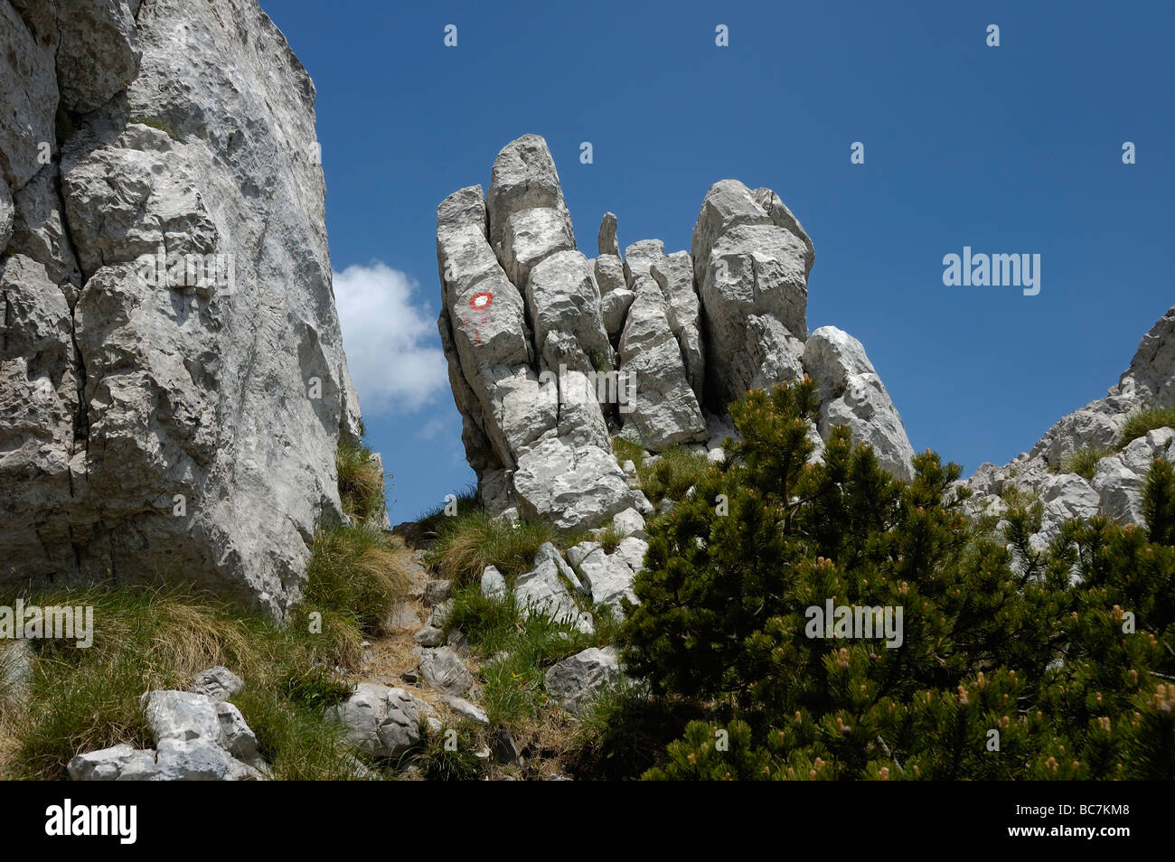 Hiking trail through the narrow passage between rocks Stock Photo - Alamy