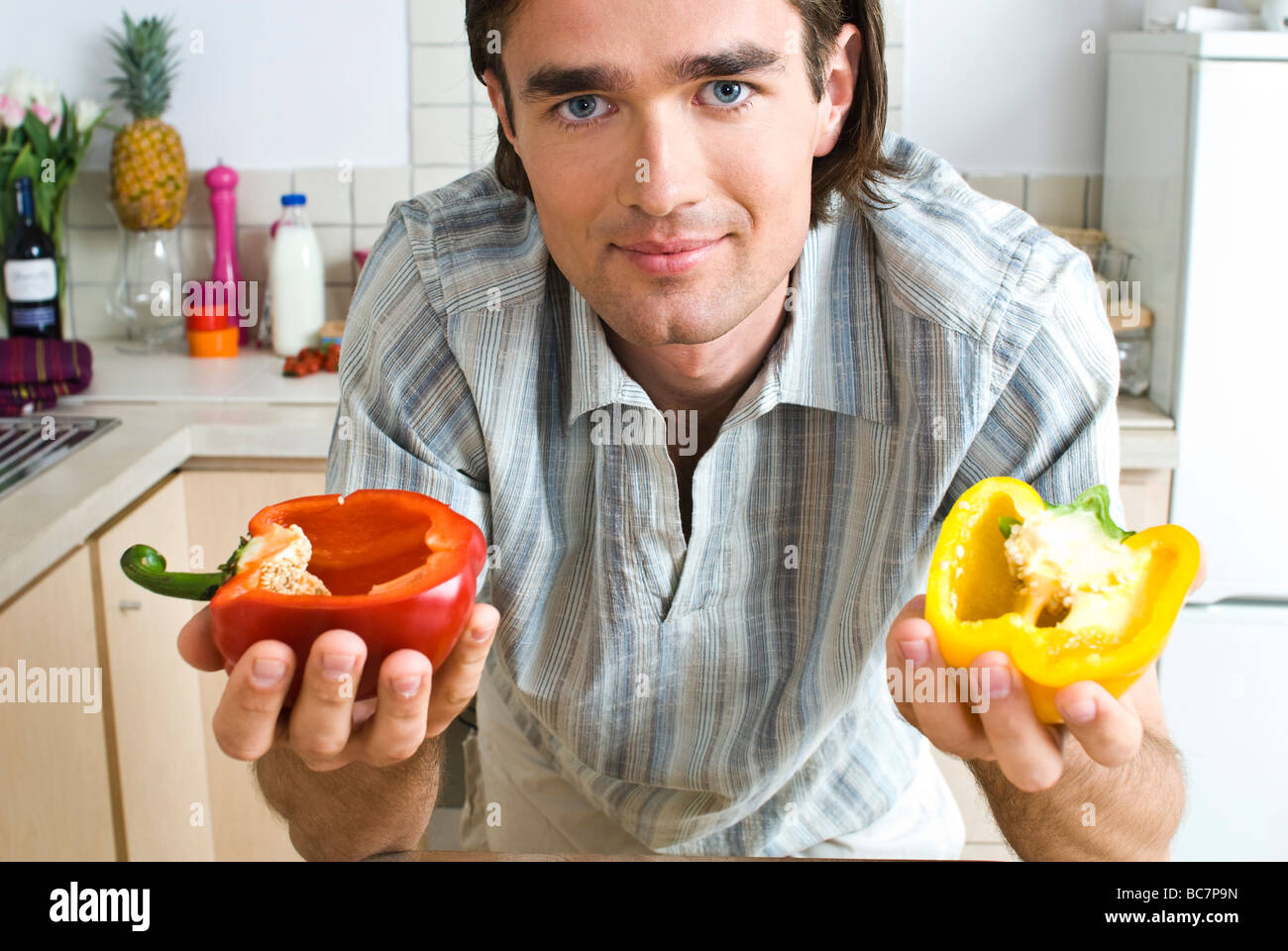 man holding pepper Stock Photo - Alamy