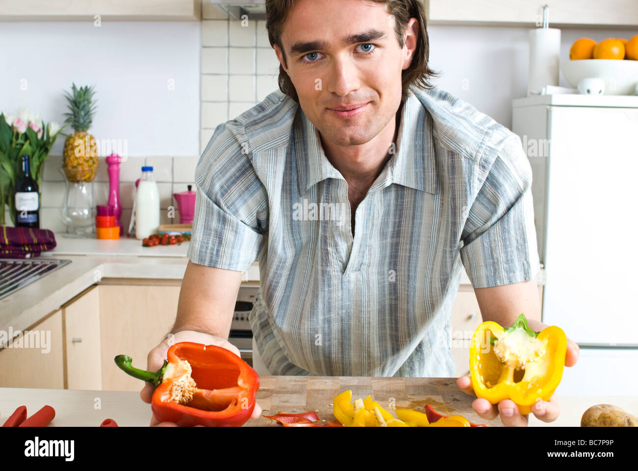 man holding pepper Stock Photo - Alamy