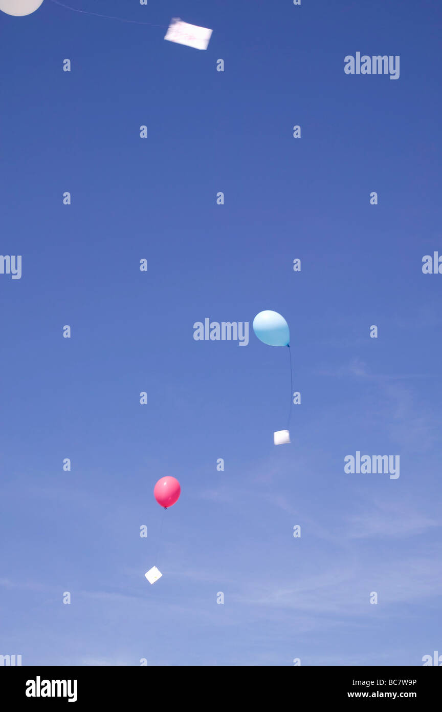 Balloons with letters floating in the sky Stock Photo - Alamy