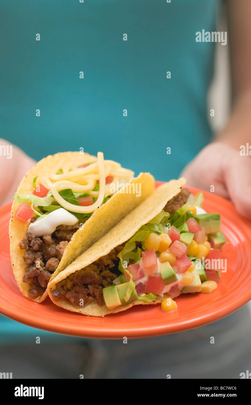 Woman serving mexican tacos hi-res stock photography and images - Alamy
