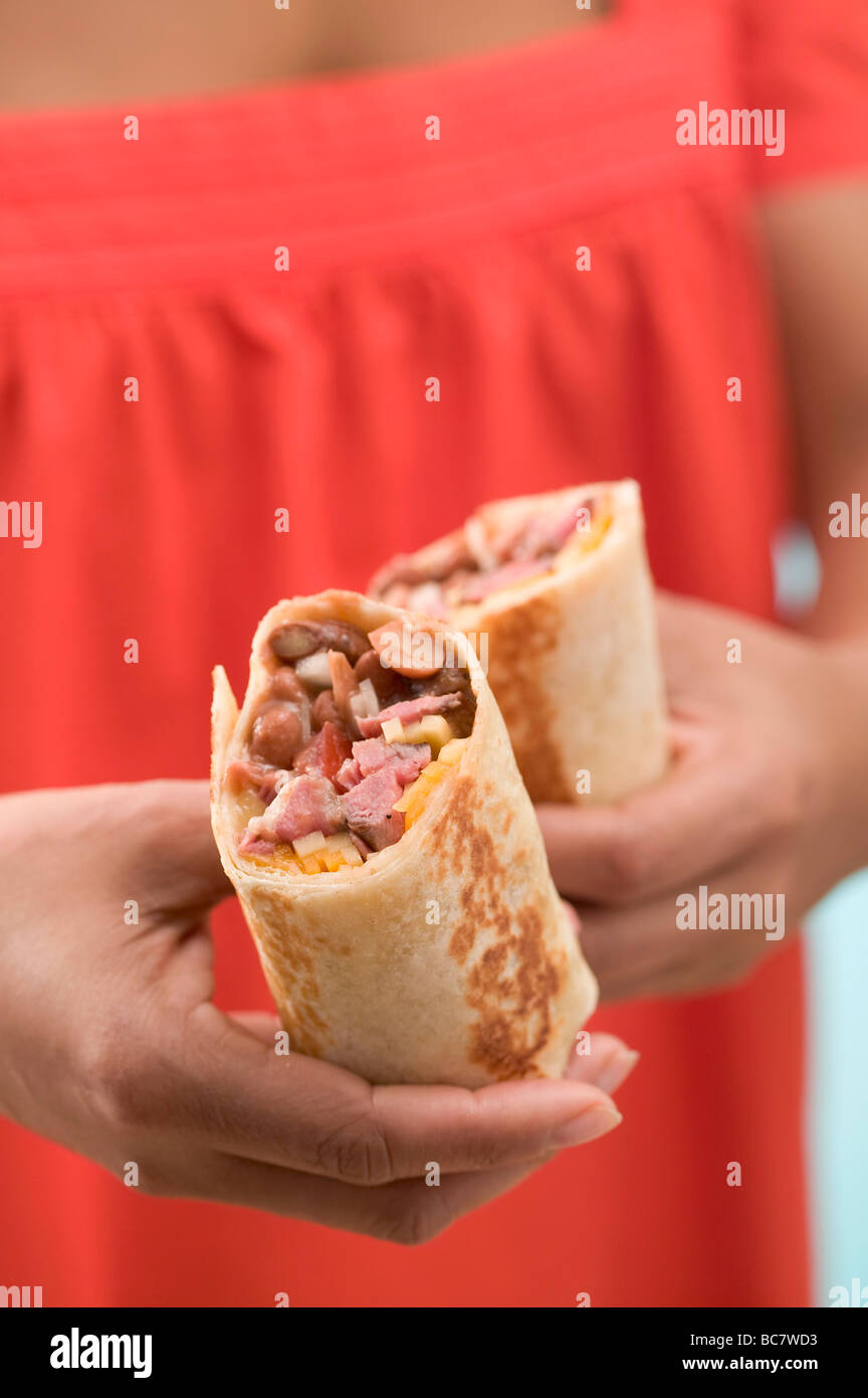Woman holding two wraps Stock Photo - Alamy