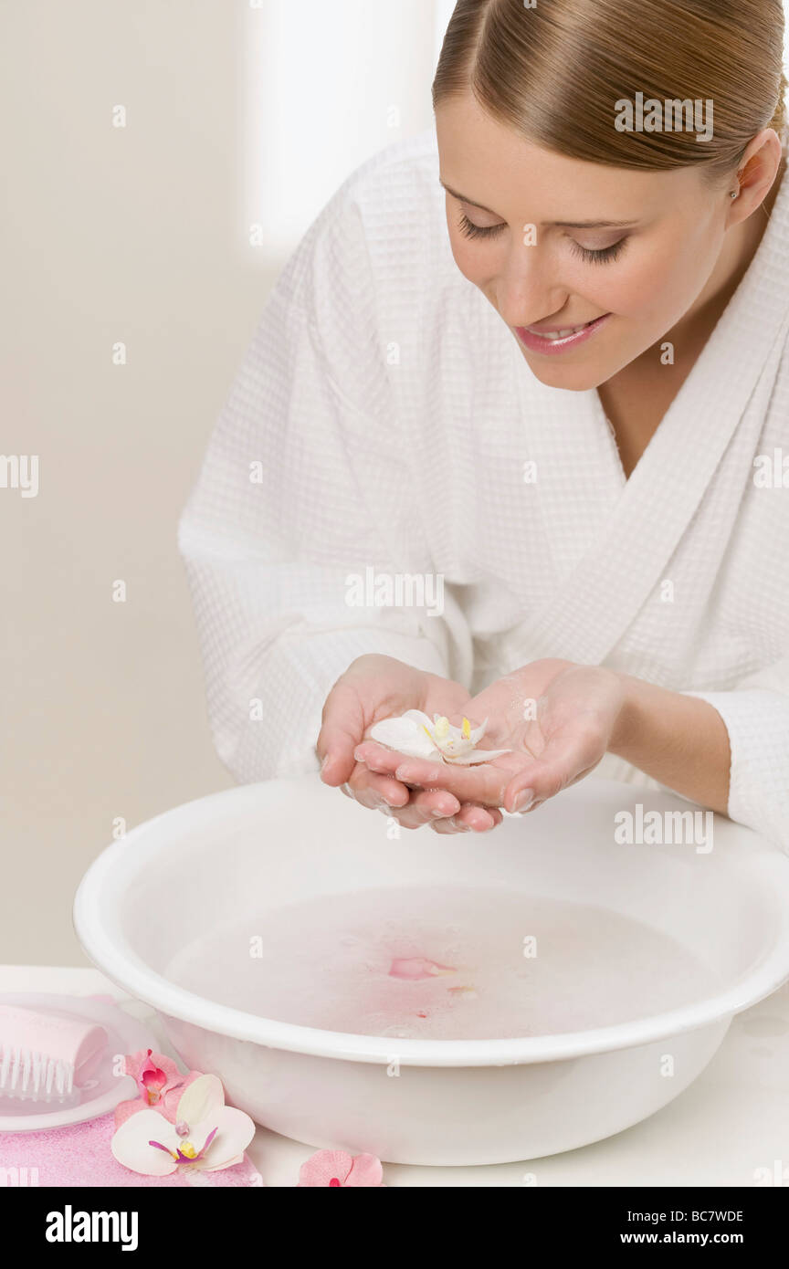 Woman washing in flower water Stock Photo - Alamy