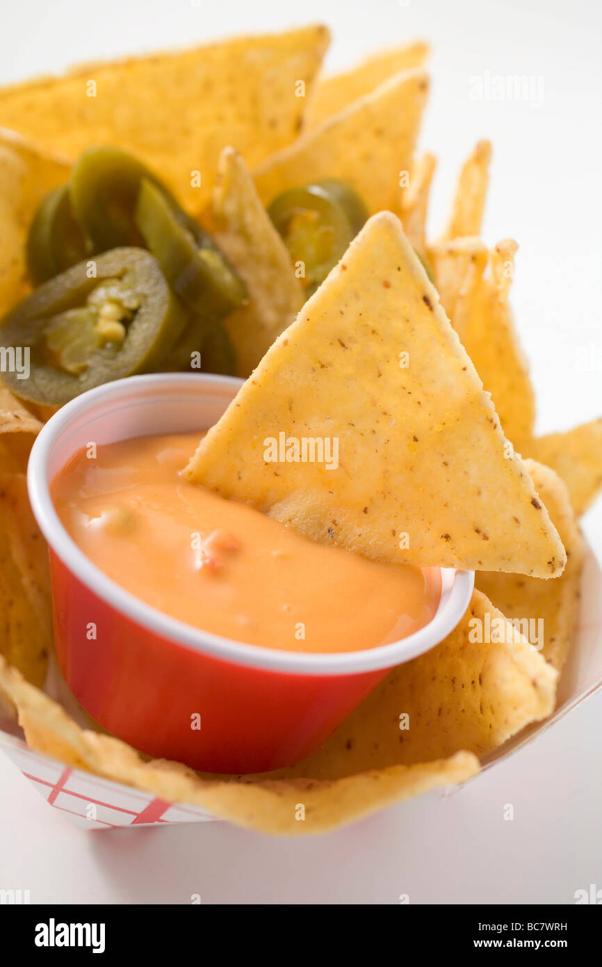 Nachos with chilli rings and dip (close-up Stock Photo - Alamy