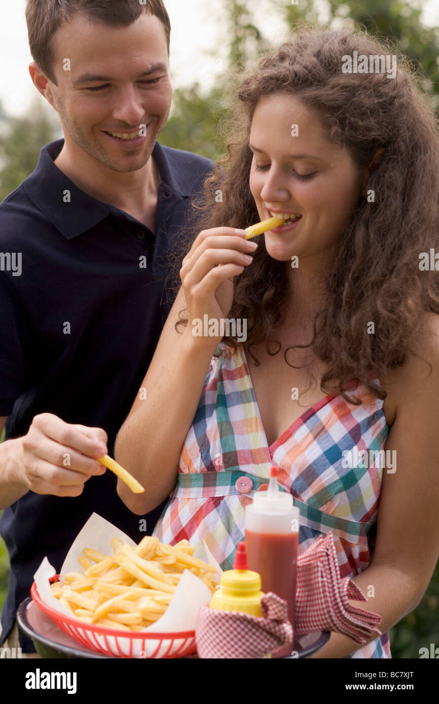Old couple eating chips hi-res stock photography and images - Alamy