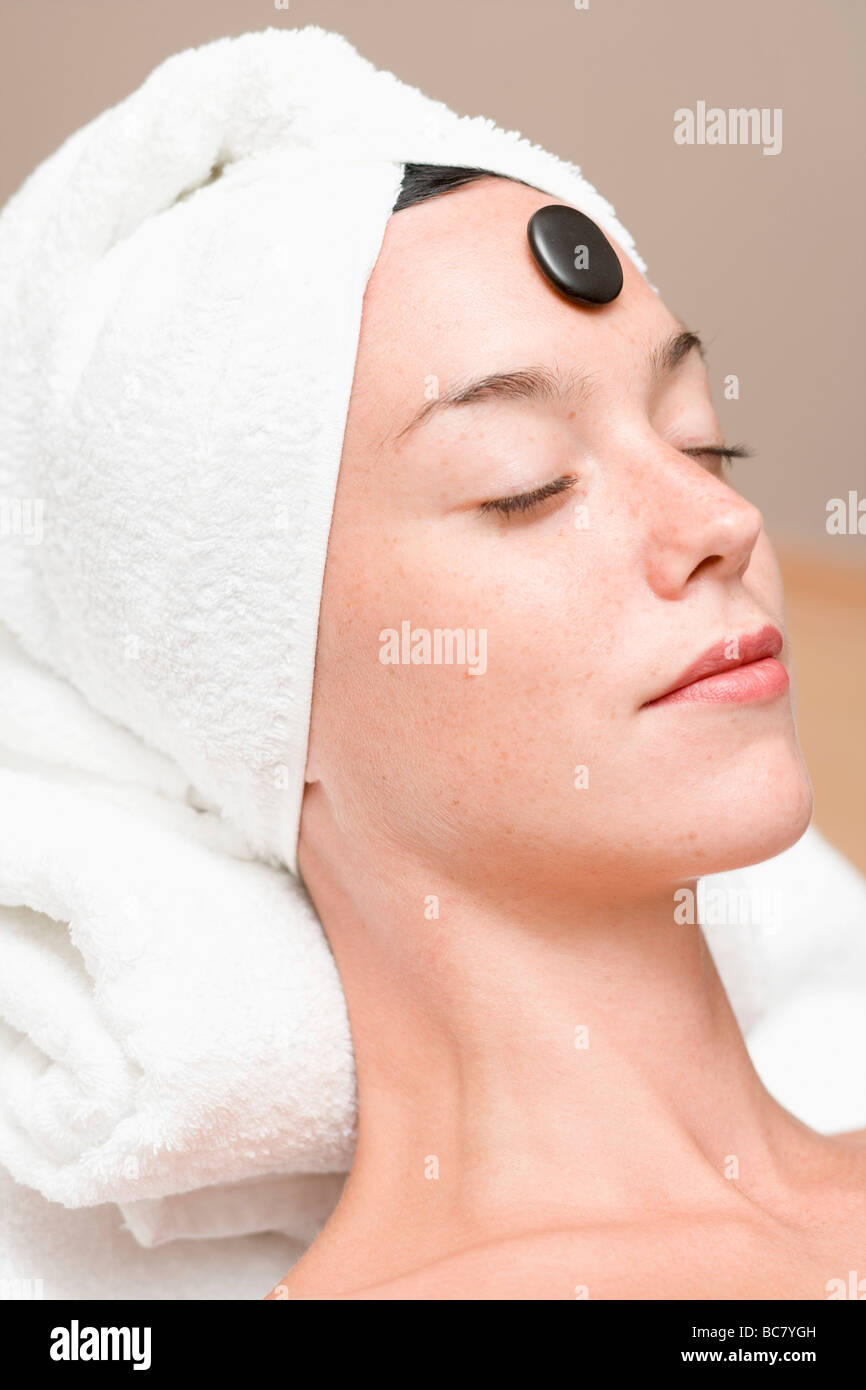 Woman having LaStone Therapy (healing therapy using stones Stock Photo ...