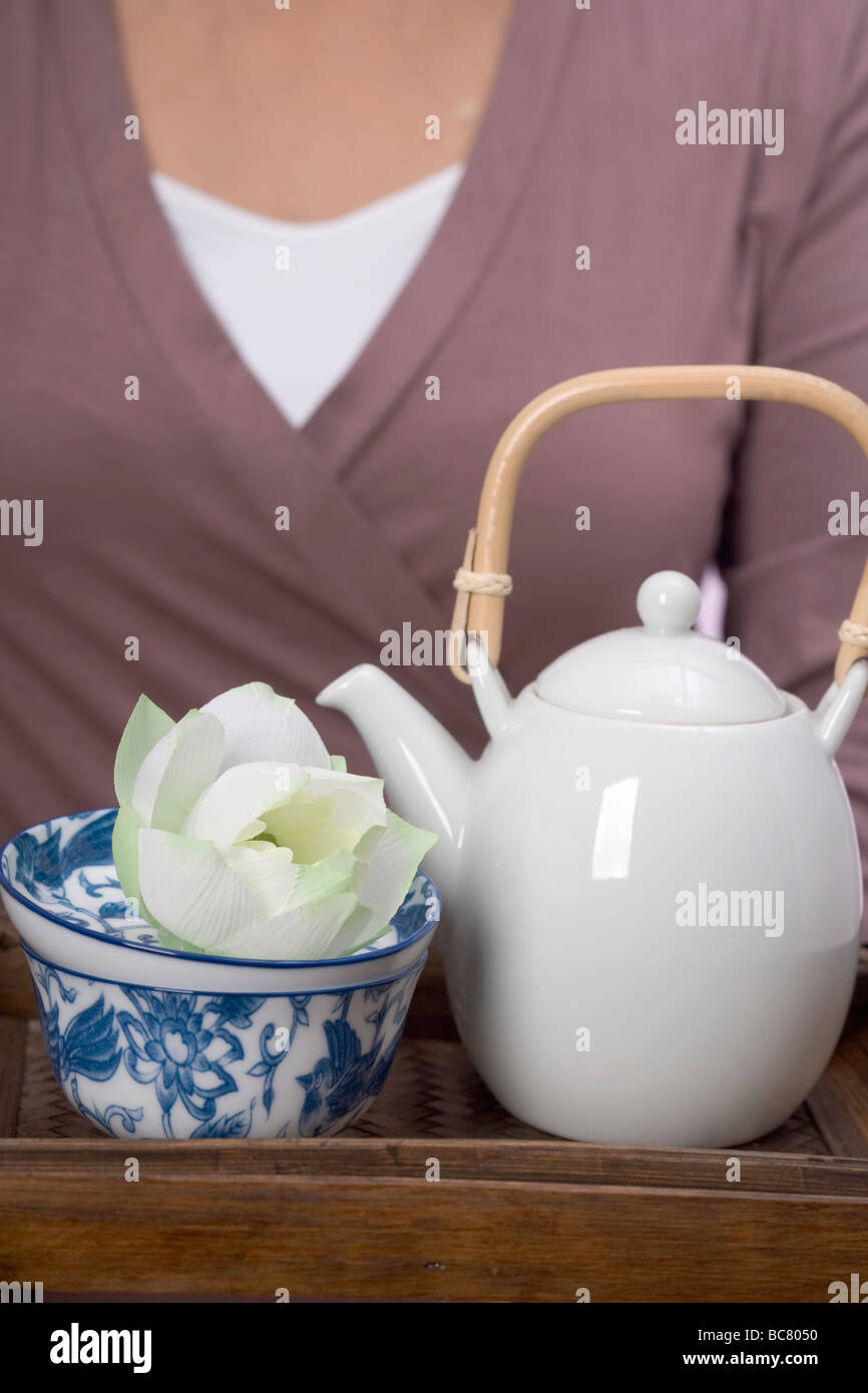 Asian woman holding bowl tea hi-res stock photography and images - Alamy