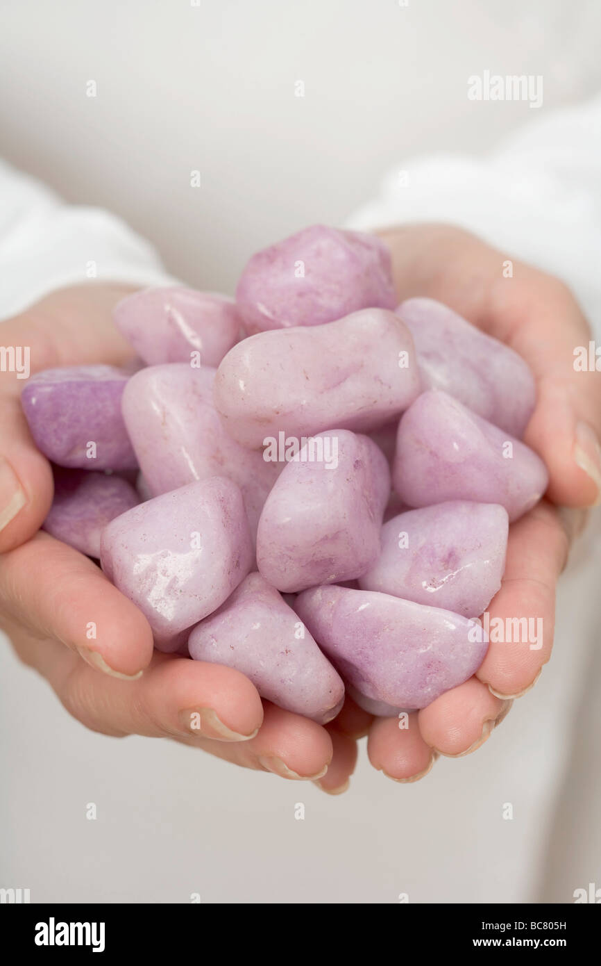 Hands holding healing stones Stock Photo - Alamy