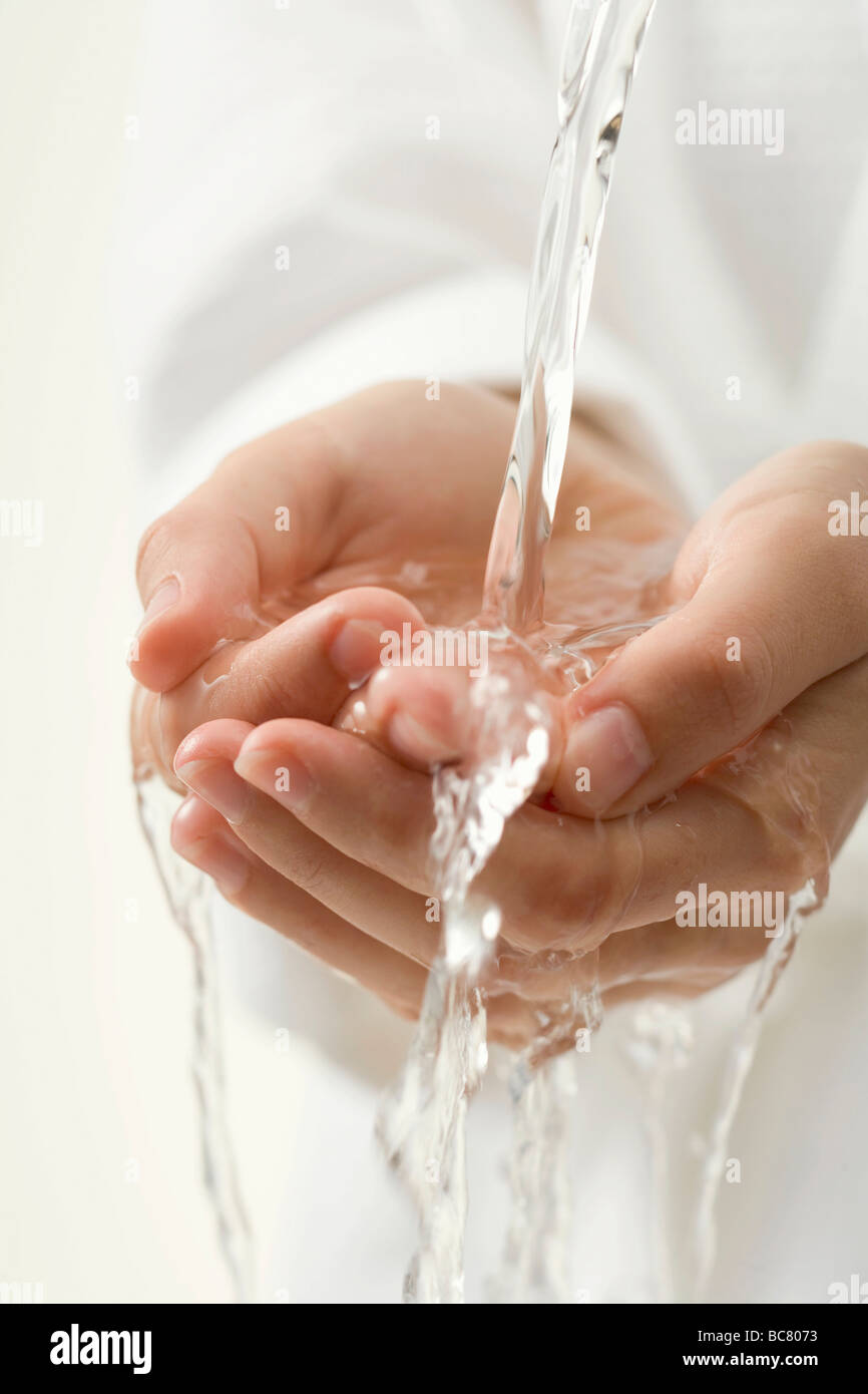 Hands under running water Stock Photo - Alamy