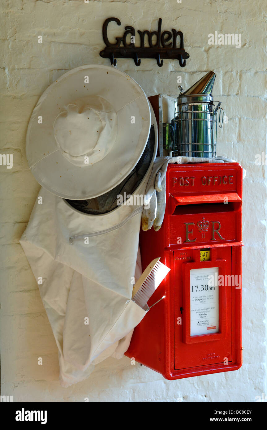 Bee keeping equipment with traditional British Post box Stock Photo - Alamy