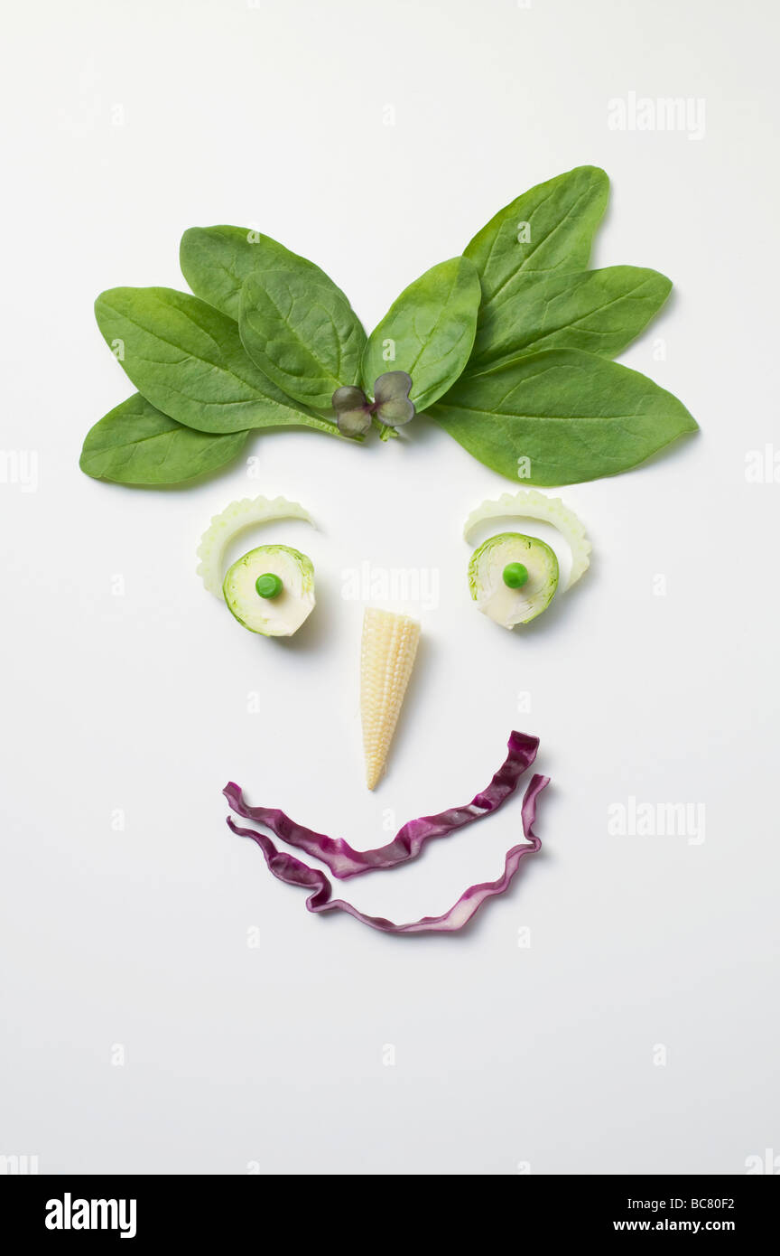 Vegetable face with spinach hair Stock Photo - Alamy