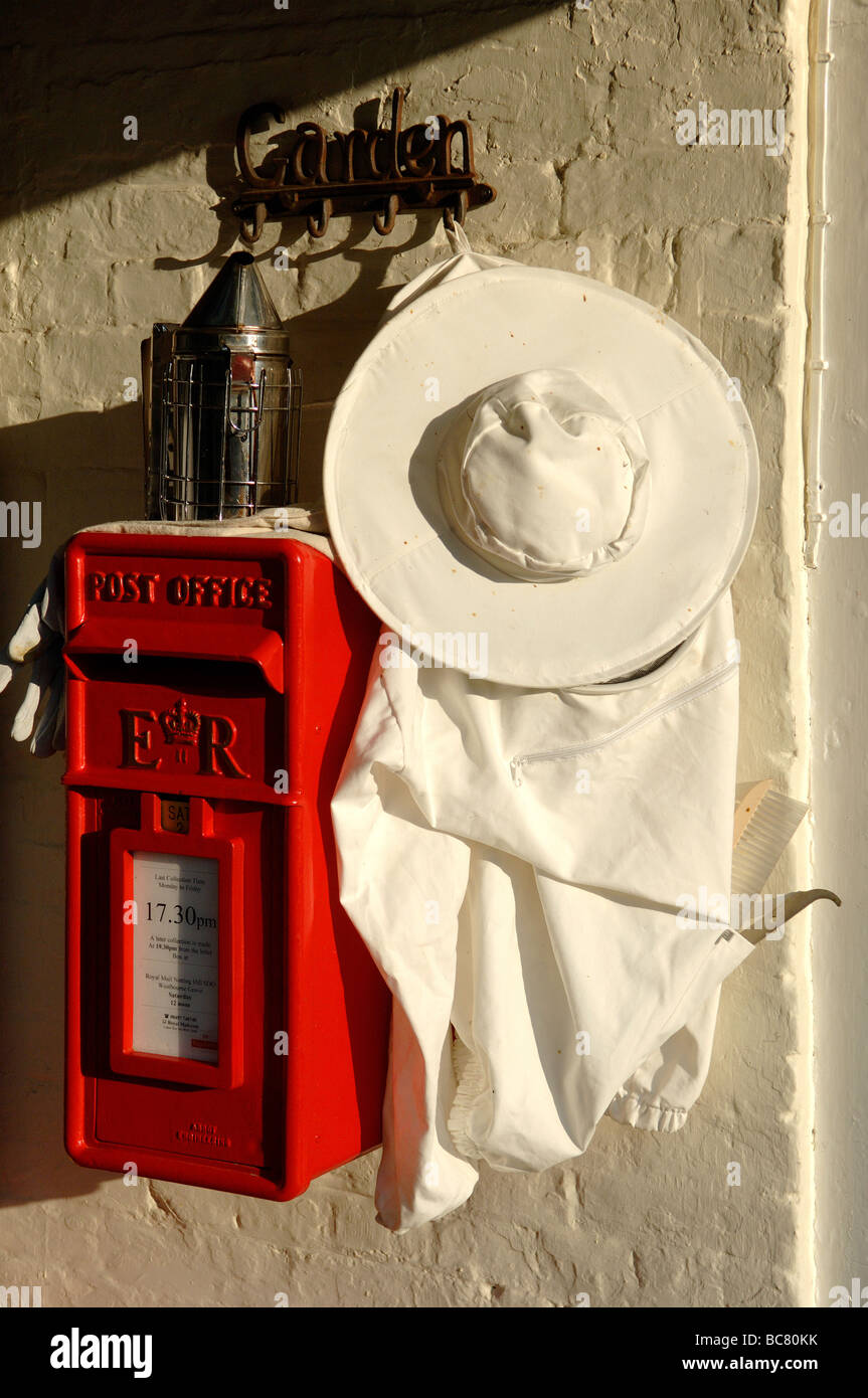 Bee keeping equipment with traditional British Post box Stock Photo - Alamy