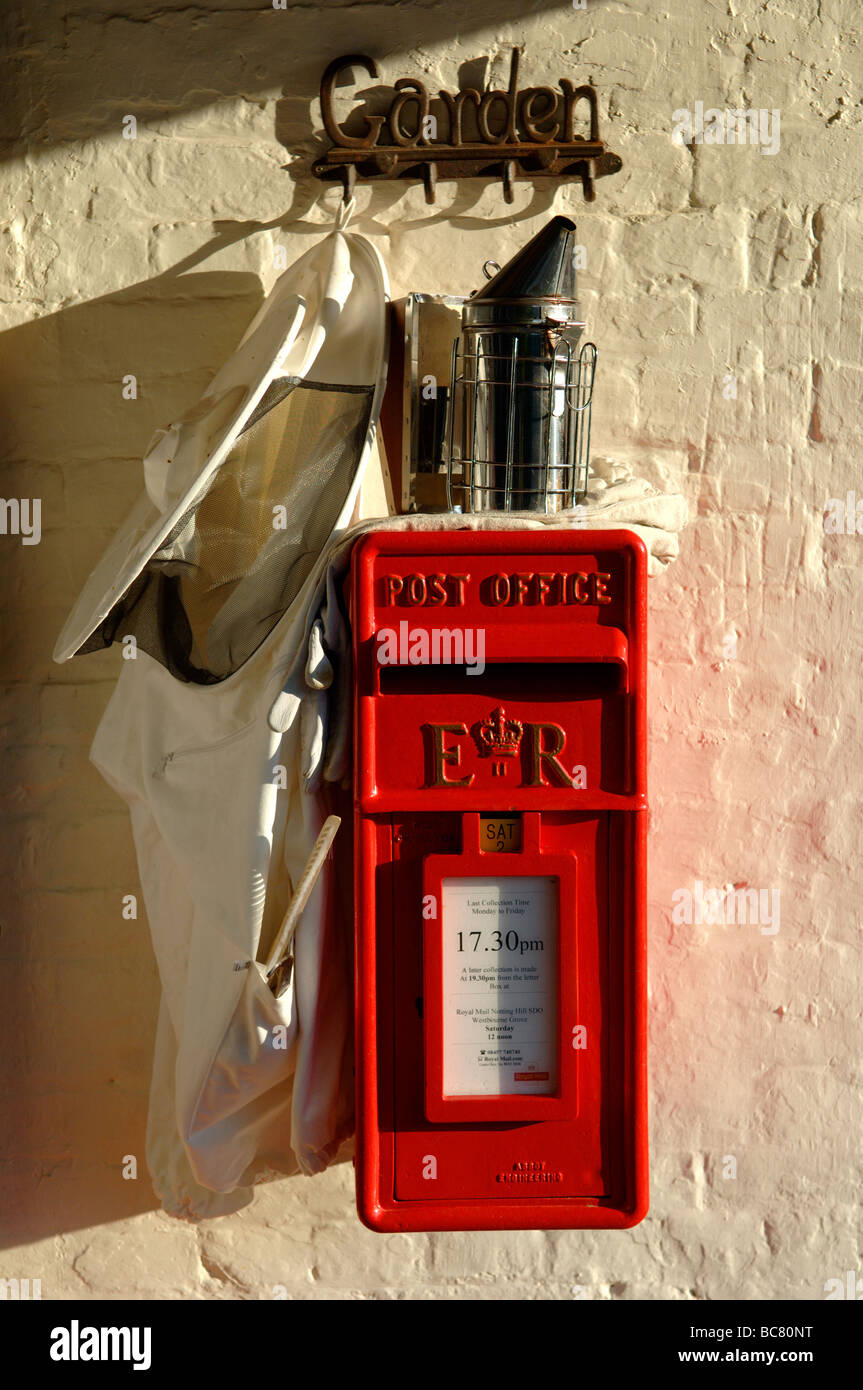Bee keeping equipment with traditional British Post box Stock Photo - Alamy