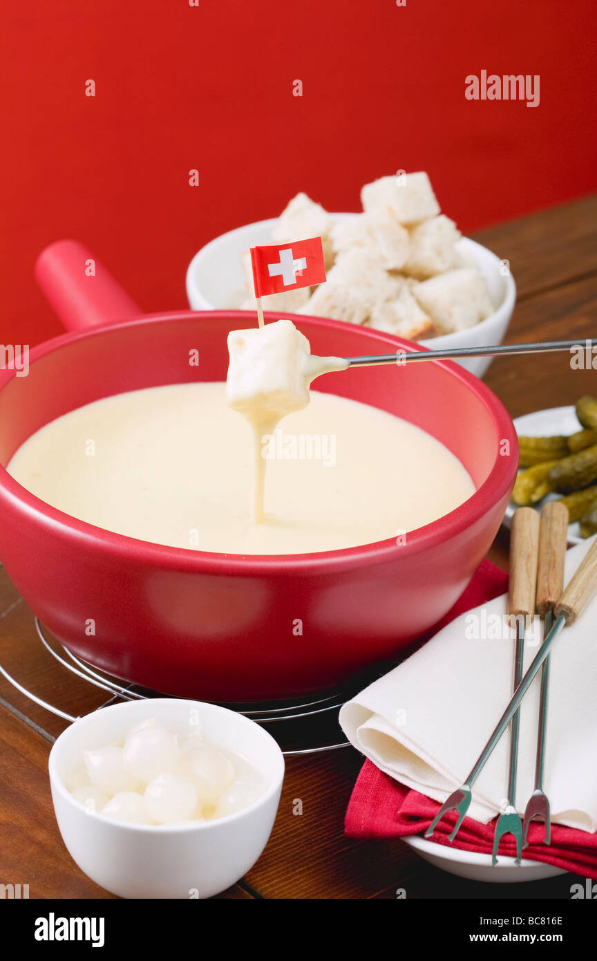 Cheese fondue with Swiss flag Stock Photo - Alamy