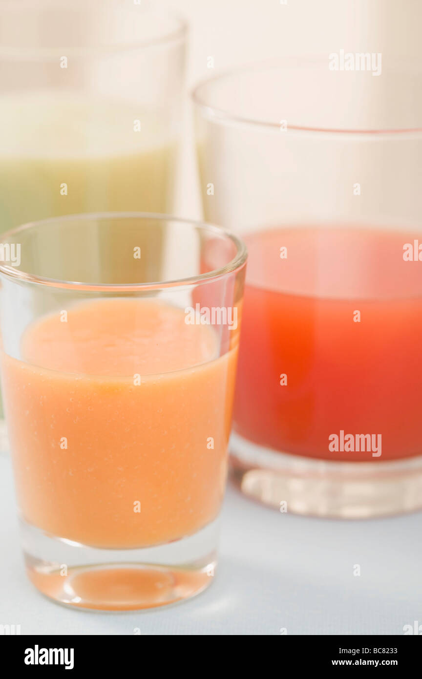 Three different juices in glasses Stock Photo - Alamy