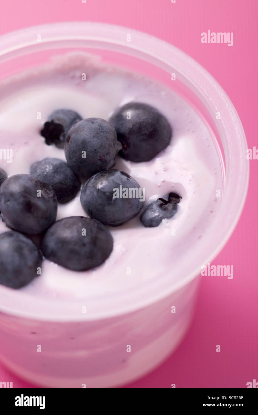Blueberry yoghurt in plastic pot Stock Photo - Alamy