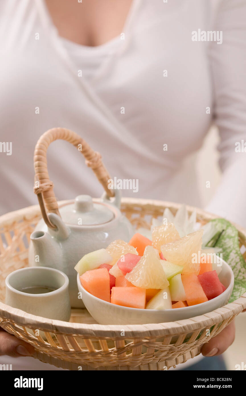 Woman hand offering tea hi-res stock photography and images - Alamy