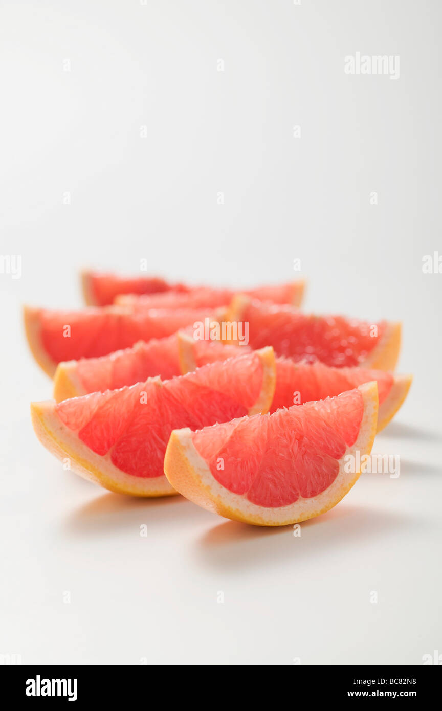 Wedges of pink grapefruit Stock Photo - Alamy
